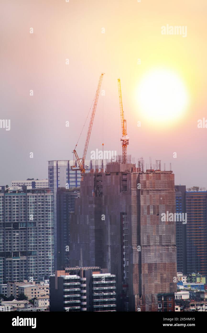 about a twin tower crane at the construction building working through ...