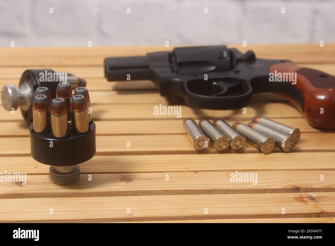 Vintage Revolver Gun With Ammo and Speed Loader Stock Photo - Alamy