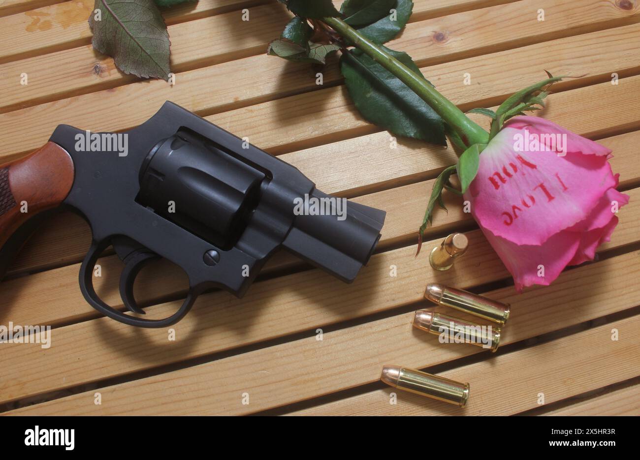 Vintage Gun With Bullets and Rose. Revolver and Ammo Stock Photo - Alamy
