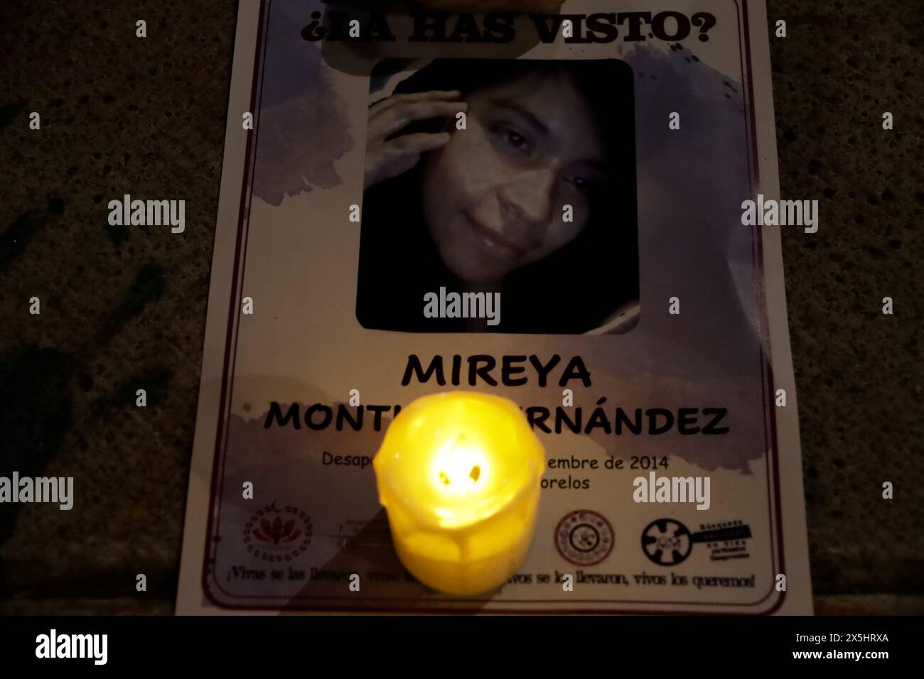 Non Exclusive: A portrait of missing people are seen during a vigil of ...