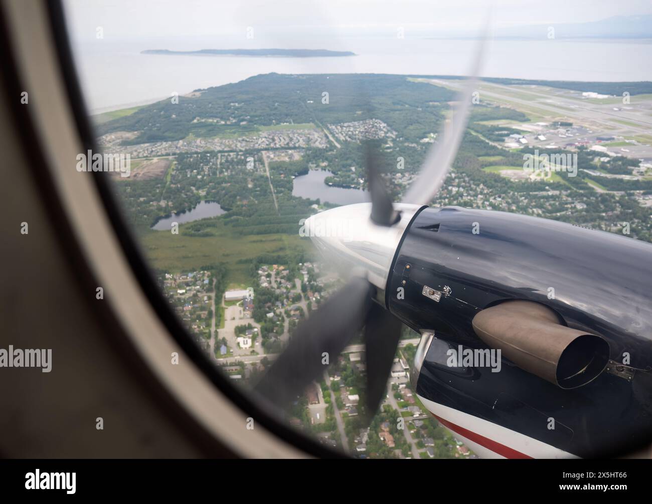 Aerial view of Anchorage from a small airplane with a running propeller ...