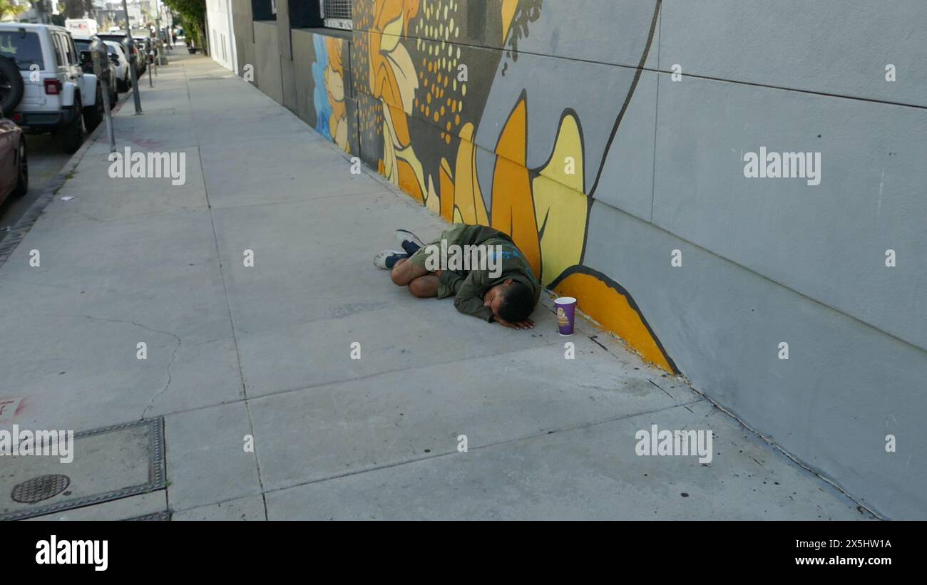 Los Angeles, California, USA 9th May 2024 Homeless man sleeping on ...