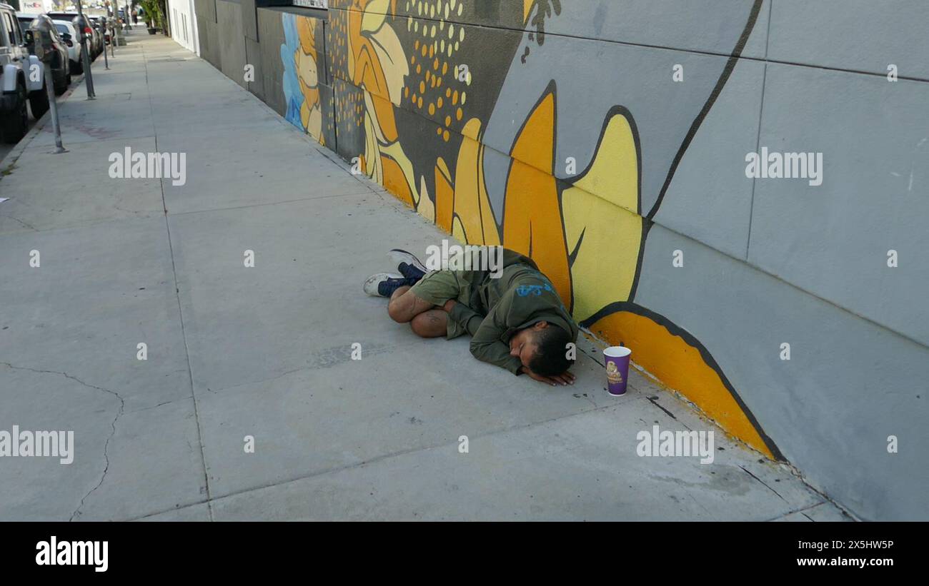 Los Angeles, California, USA 9th May 2024 Homeless man sleeping on ...