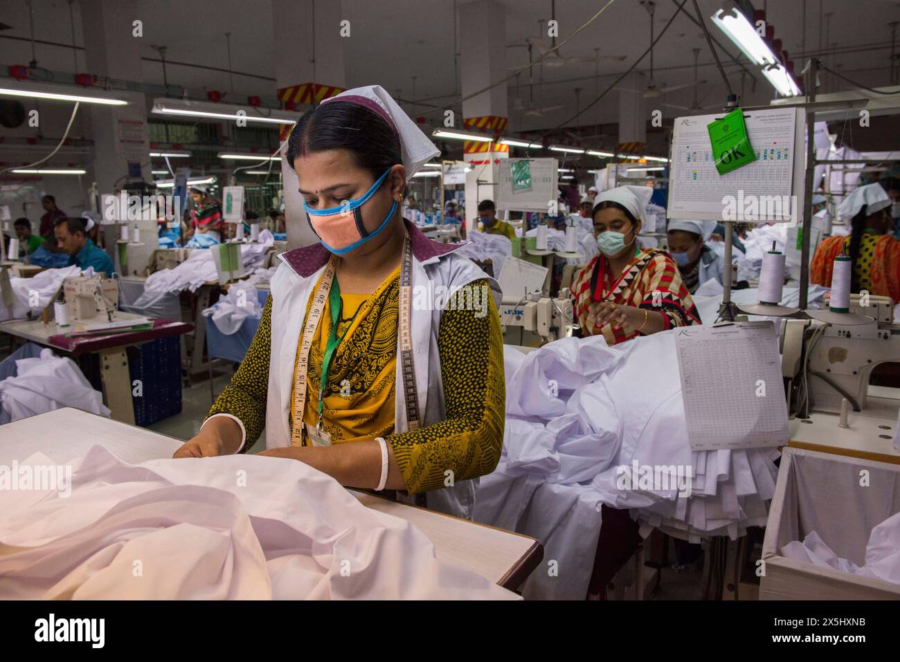 South Asia, Bangladesh, Dhaka. People work in a garment factory. (Editorial use only Stock Photo ...