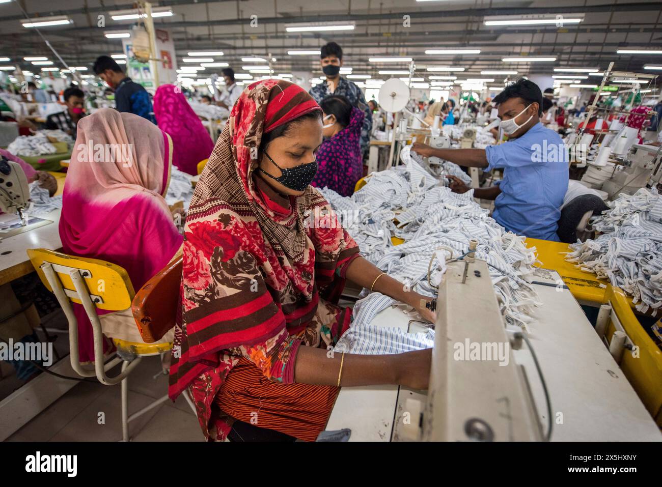South Asia, Bangladesh, Dhaka. People working in garment factories ...