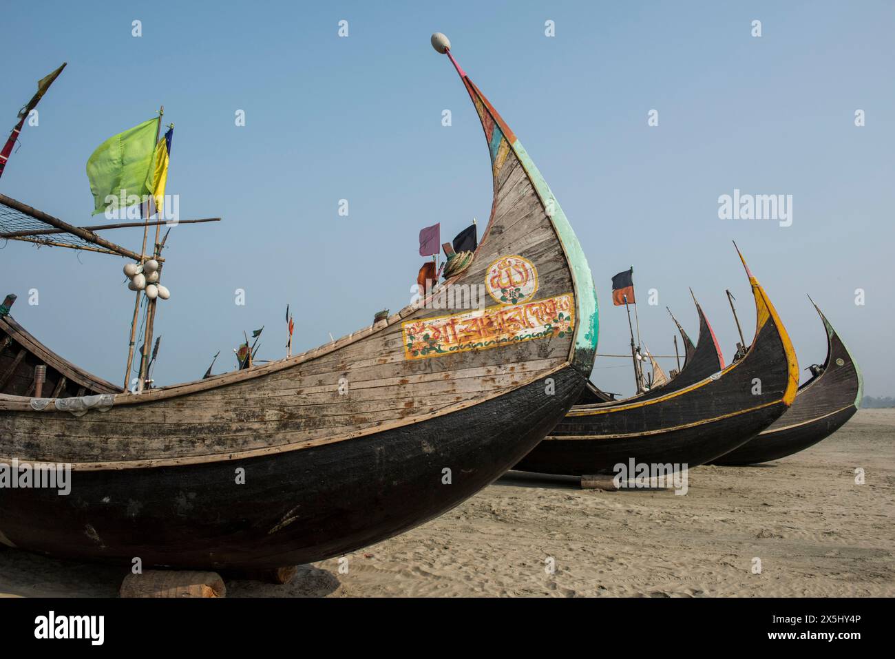 Bangladesh, Cox's Bazar Beach. Moon shaped fishing boats docked on the ...