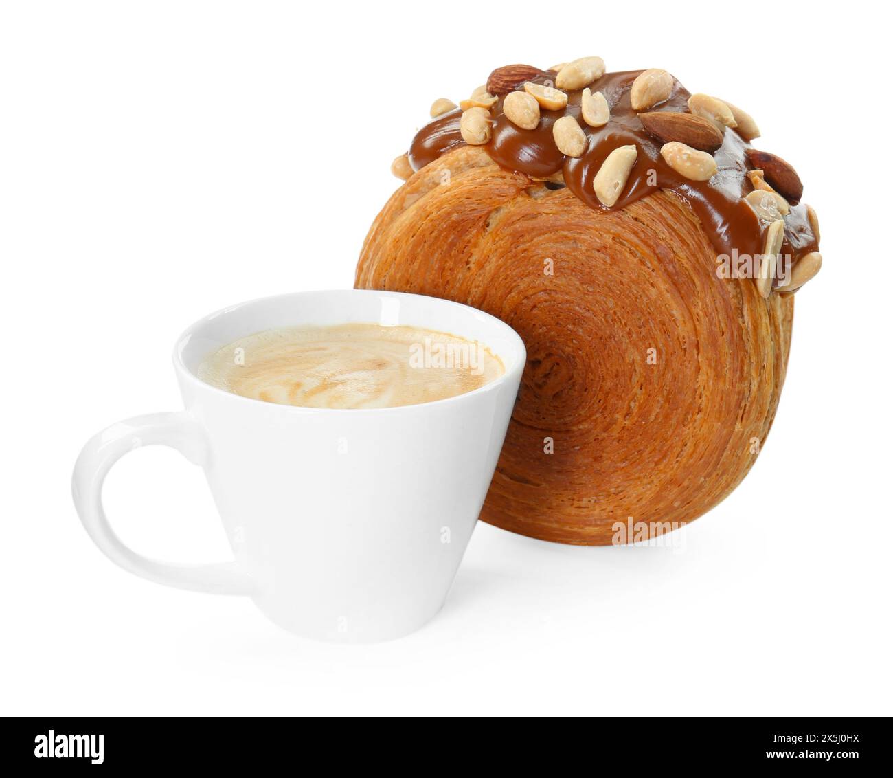 Round croissant with chocolate paste, nuts and cup of coffee isolated ...