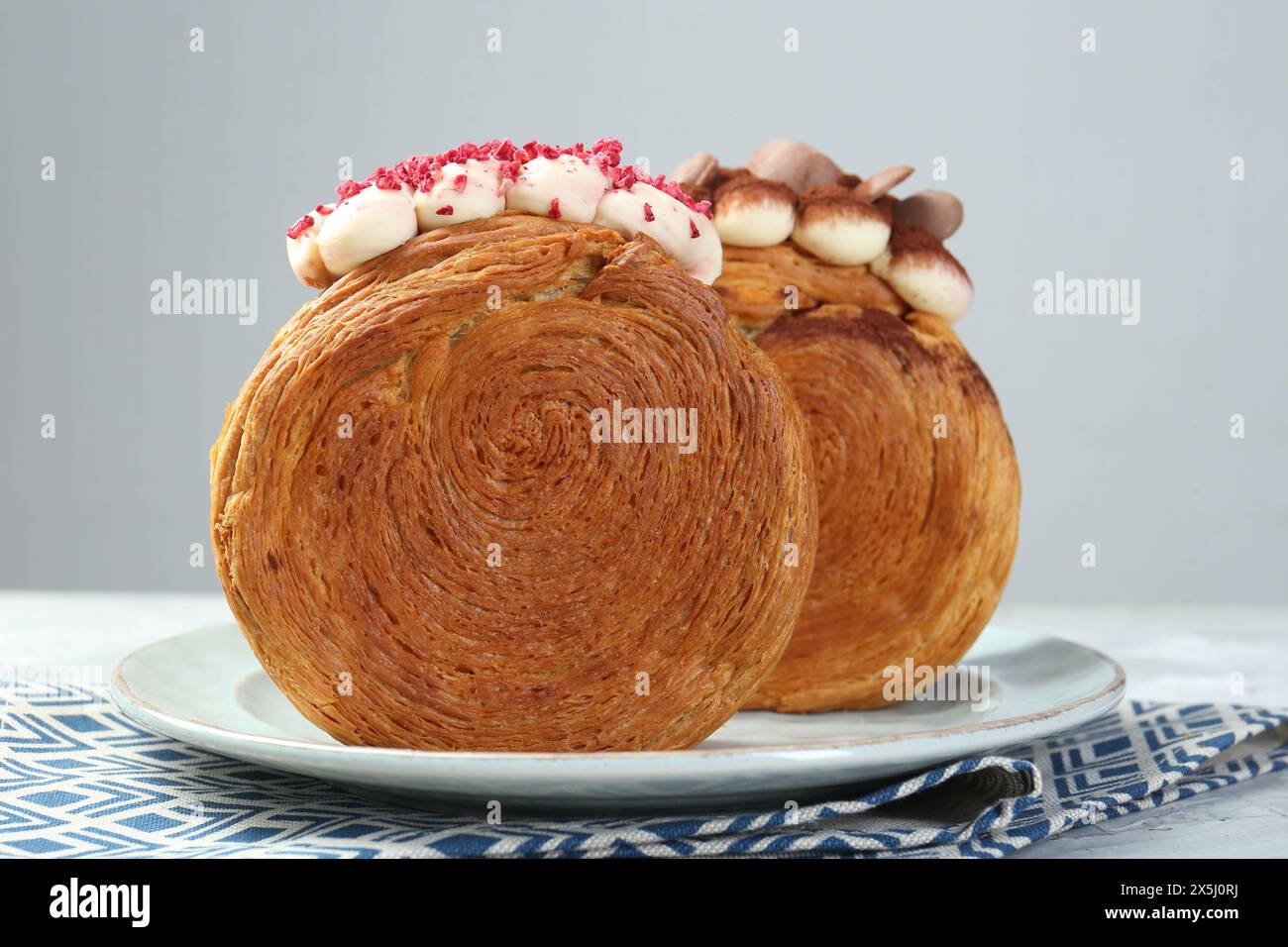 Crunchy round croissants on light table, closeup. Tasty puff pastry ...