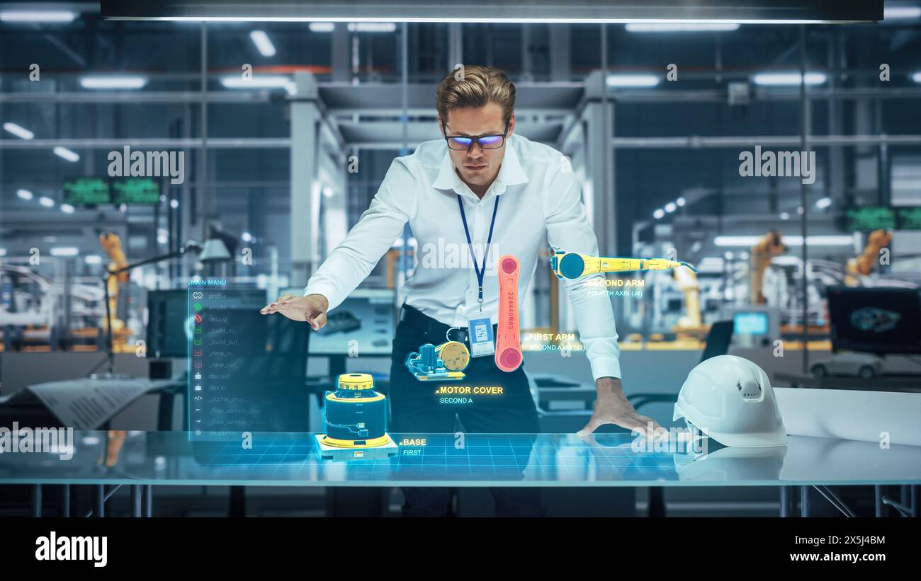 Industry 4.0 High-Tech Factory: Robotics Engineer Working on Robot Arm ...