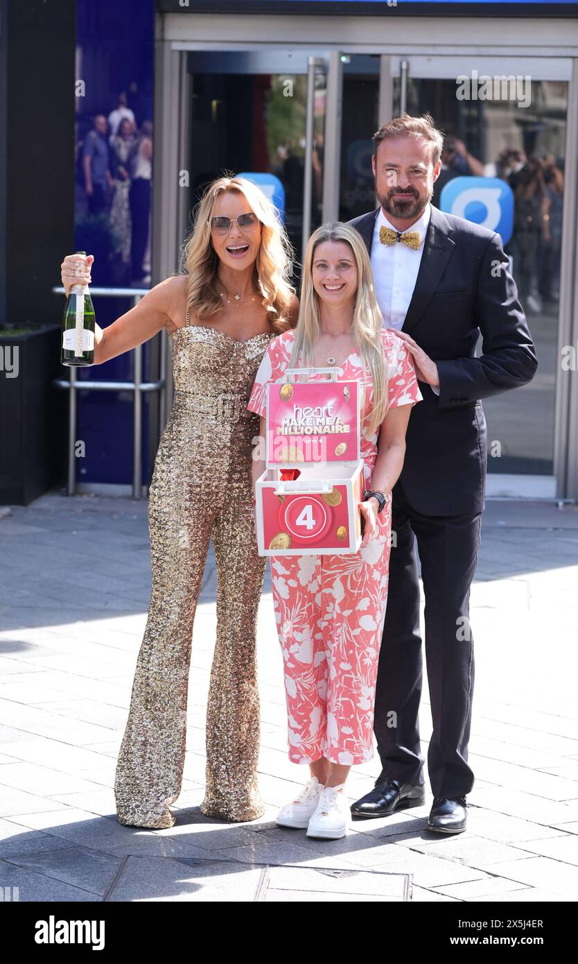 Radio presenters Amanda Holden and Jamie Theakstone celebrate with ...
