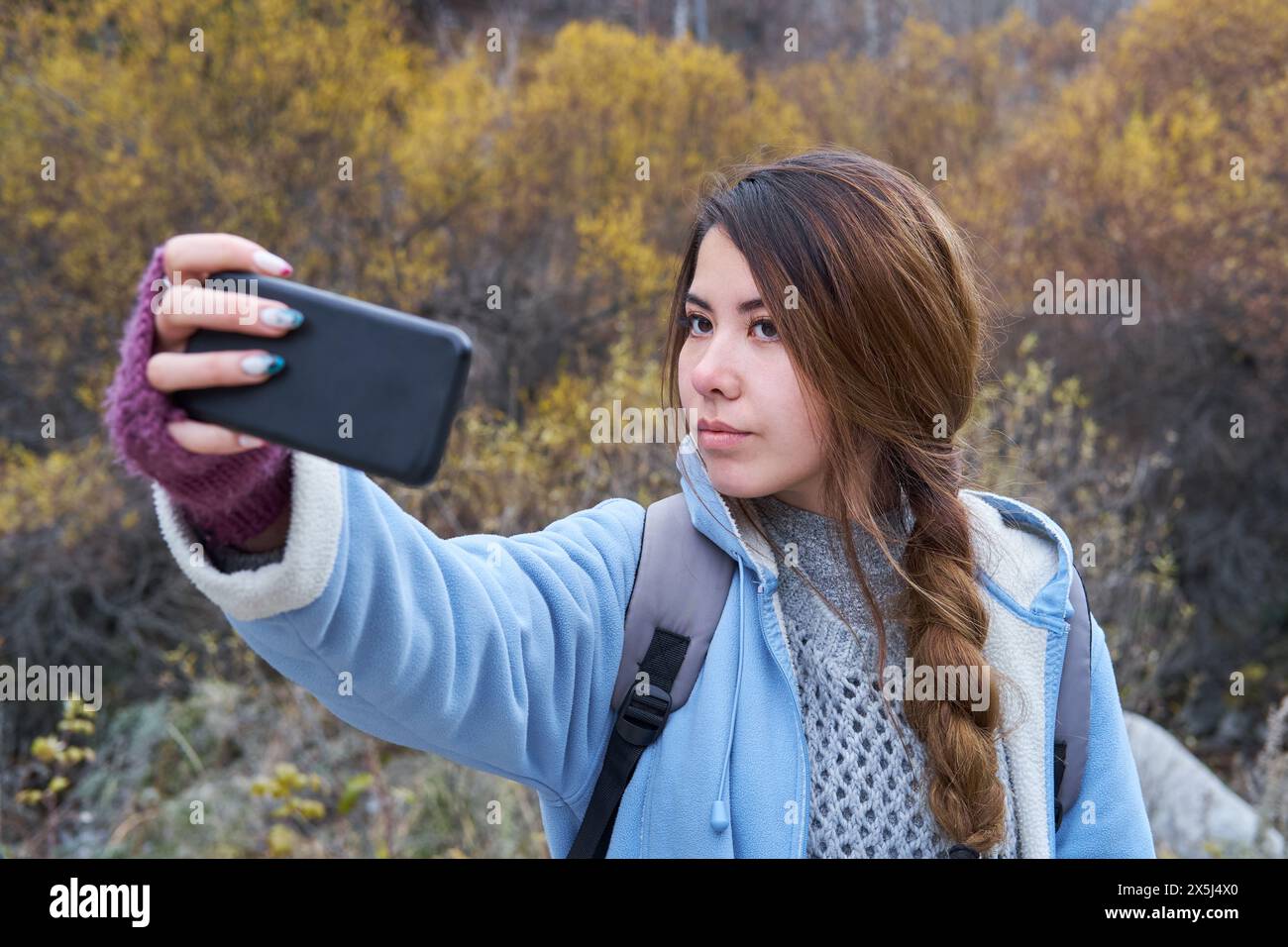 Woman takes a selfie in the forest background Stock Photo - Alamy