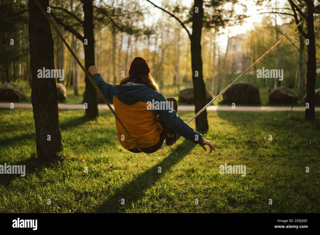 Athletic man trains on a slackline Stock Photo - Alamy