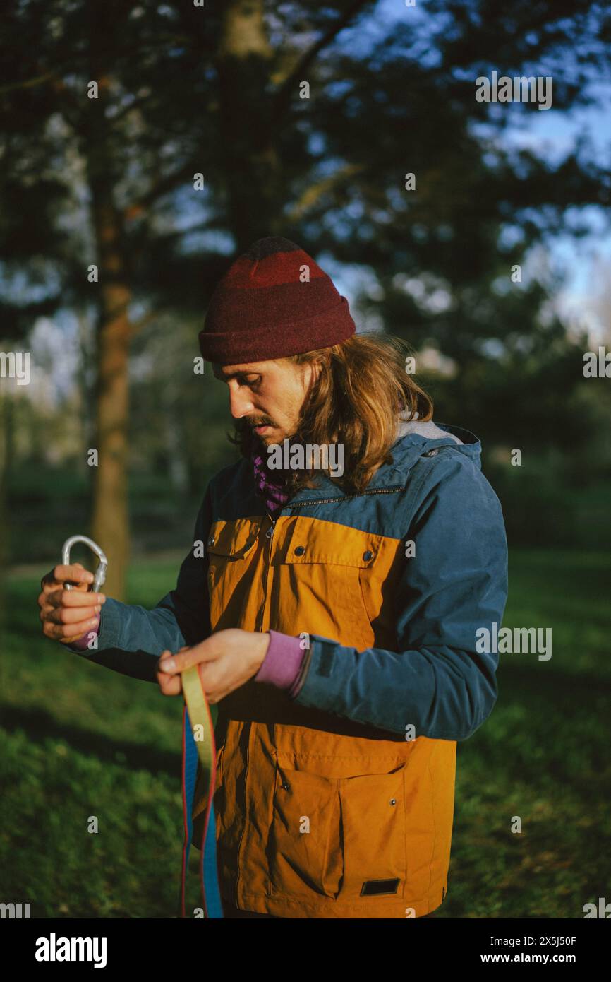 Athletic man trains on a slackline Stock Photo - Alamy