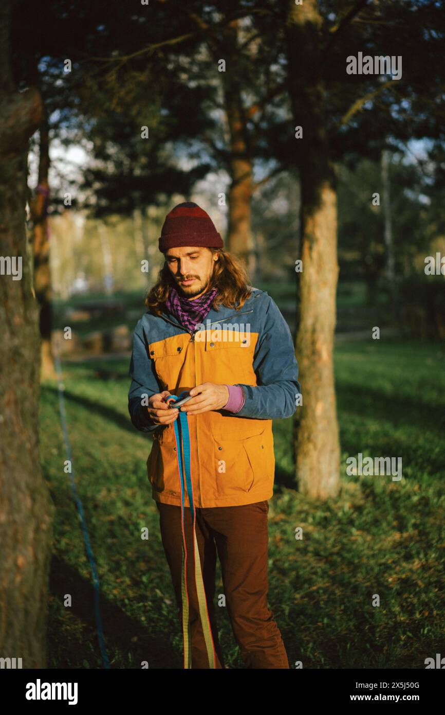 Athletic man trains on a slackline Stock Photo - Alamy