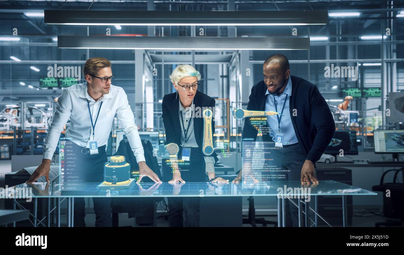 Industry 4.0 High-Tech Factory: Diverse Team of Robotics Engineers Working on Robot Arm Design ...