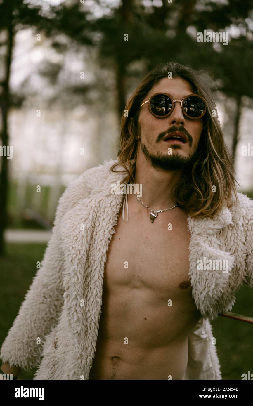 Young hippie man in sunglasses with long hair Stock Photo - Alamy