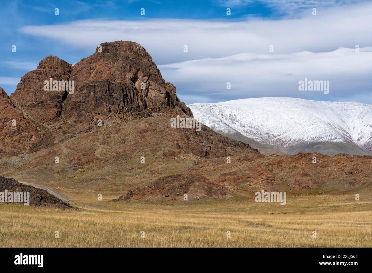 Asia, Mongolia, Bayan-Olgii Province. Rocky, rugged hills with grassy ...