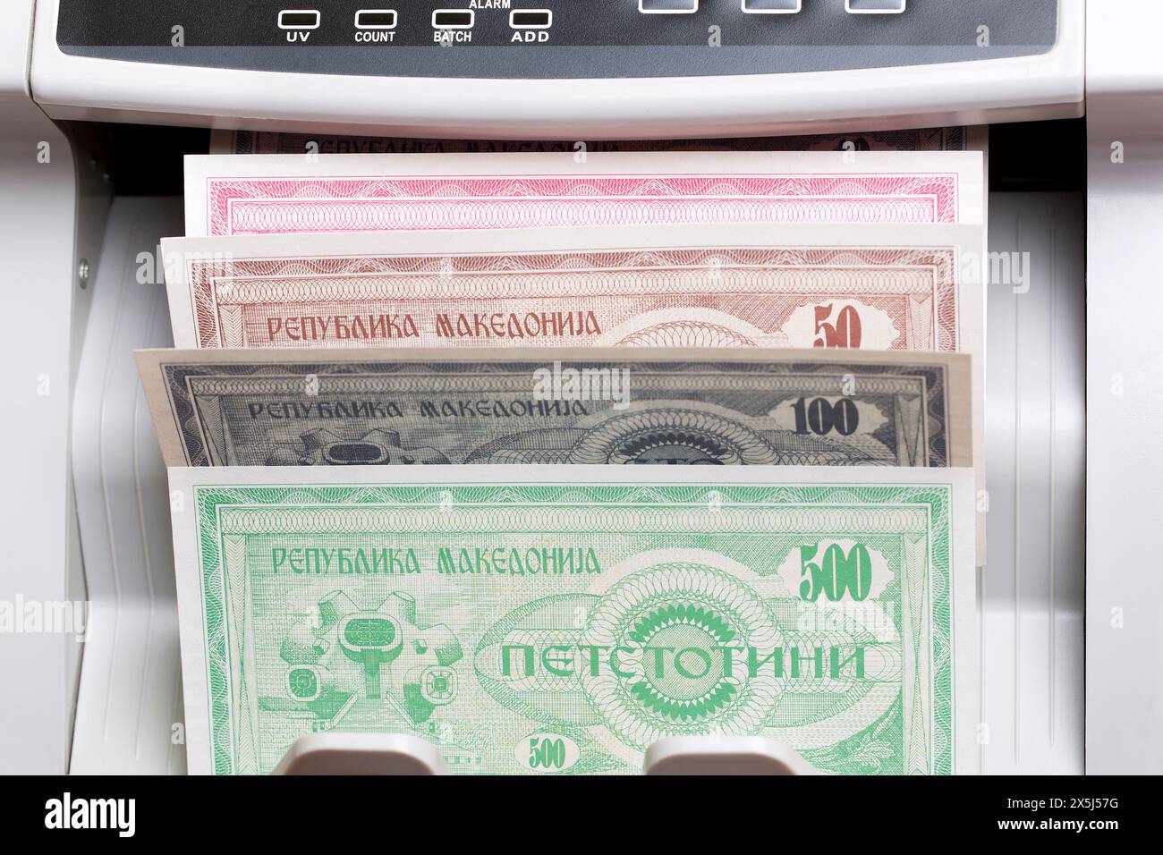 Old Macedonian money - denar in a counting machine Stock Photo - Alamy