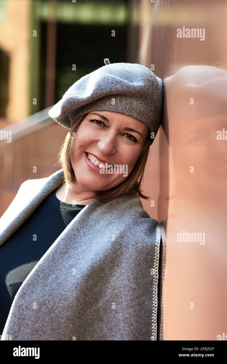 Reflective woman with intense gaze in urban setting Stock Photo - Alamy