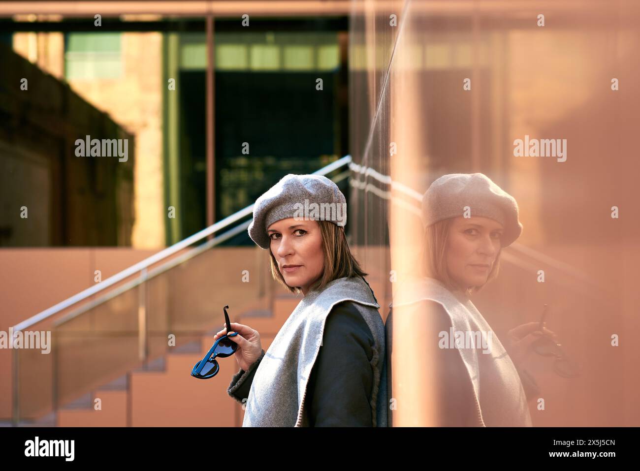 Woman in orange reflective hi-res stock photography and images - Alamy