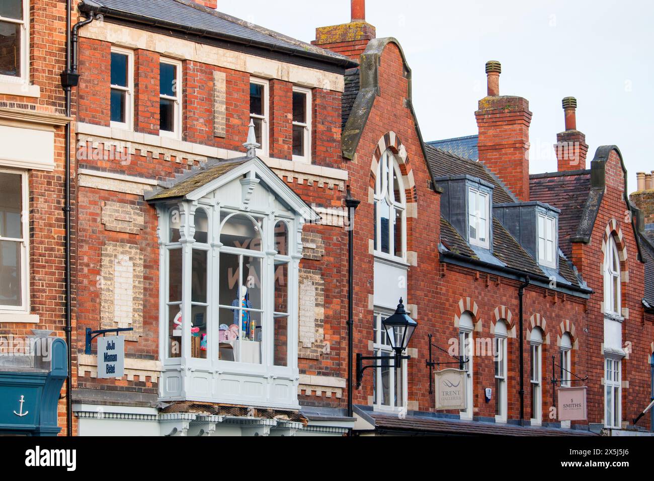 Unusual shop frontages in Sincil Street, Lincoln. The 'Cornhill Quarter ...