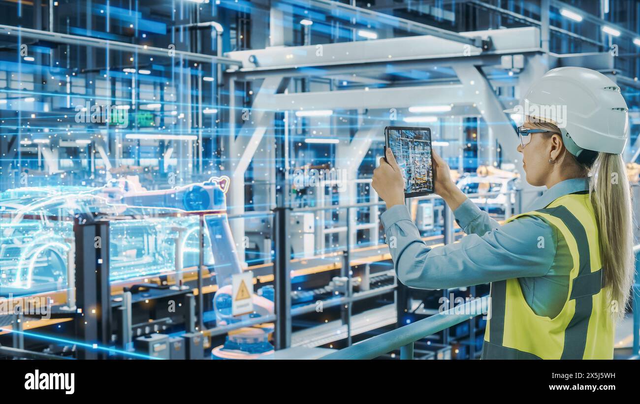 Futuristic Car Factory Digitalization Industry 4.0: Female Automotive Engineer Using Augmented ...