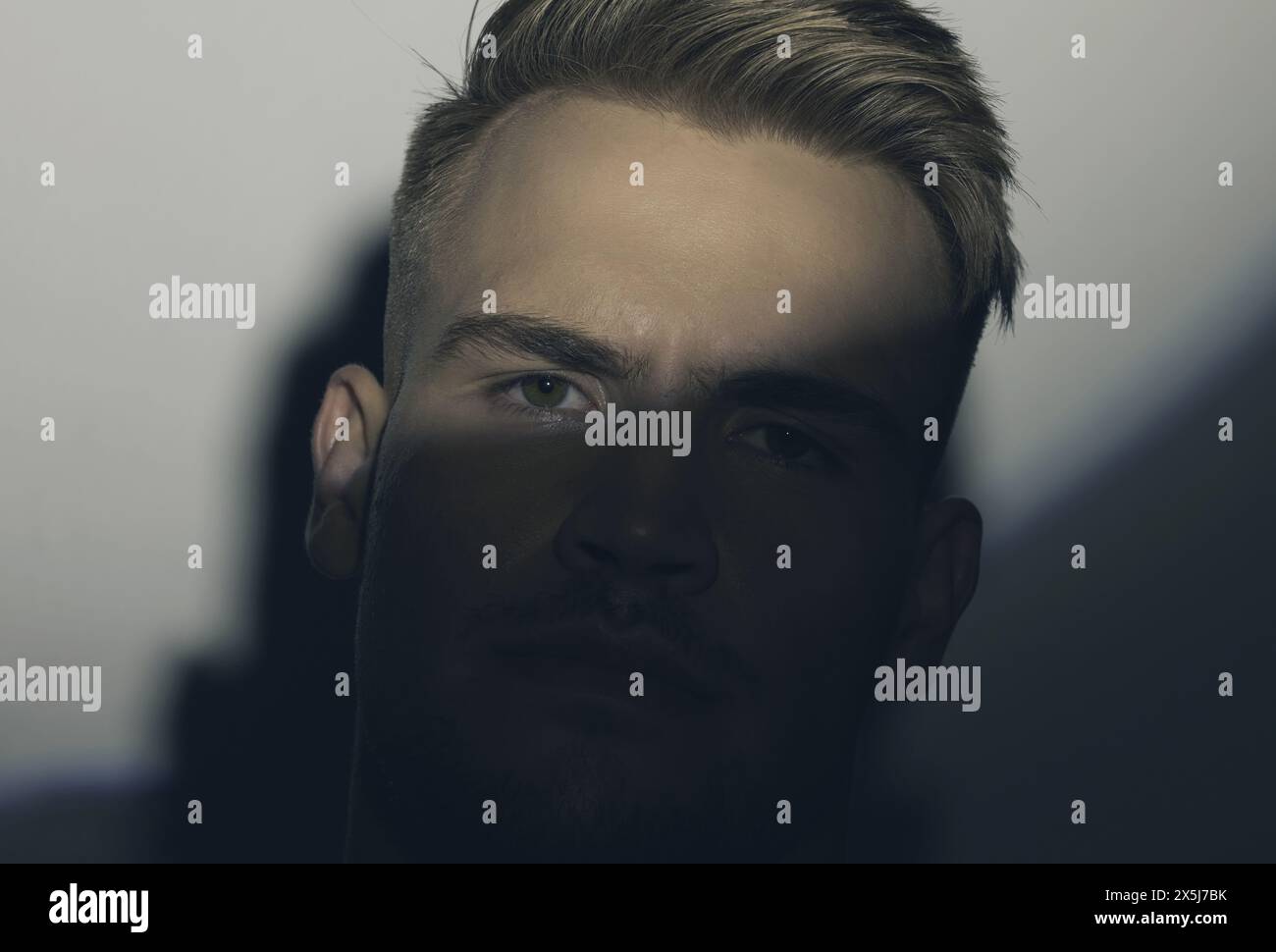 Serious, man and face with shadows in portrait and secret for mystery ...