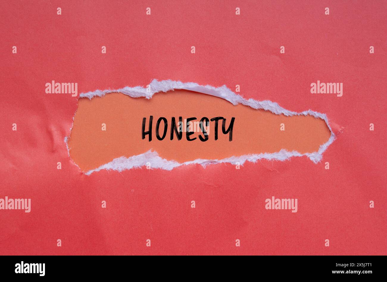 Honesty word written on torn paper with orange background. Conceptual ...