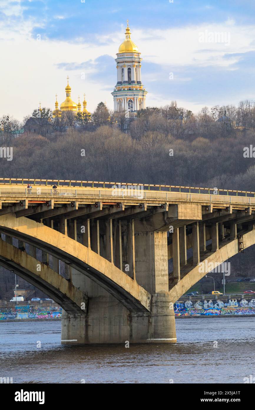 Ukraine, Kiev, Kyiv. Metro Bridge across the Dnieper River. Roofs of ...