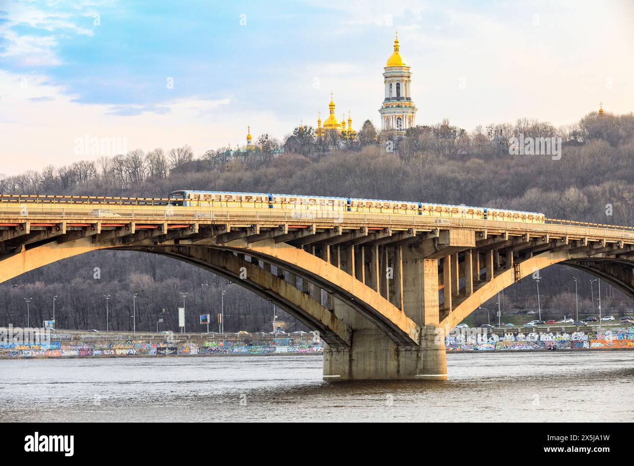 Ukraine, Kiev, Kyiv. Metro Bridge across the Dnieper River. Roofs of ...