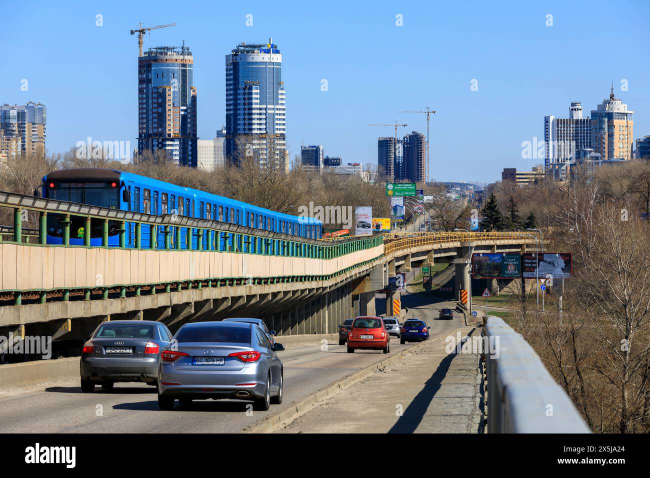 Ukraine, Kiev, Kyiv. Metro Bridge across the Dnieper River. Cars and ...
