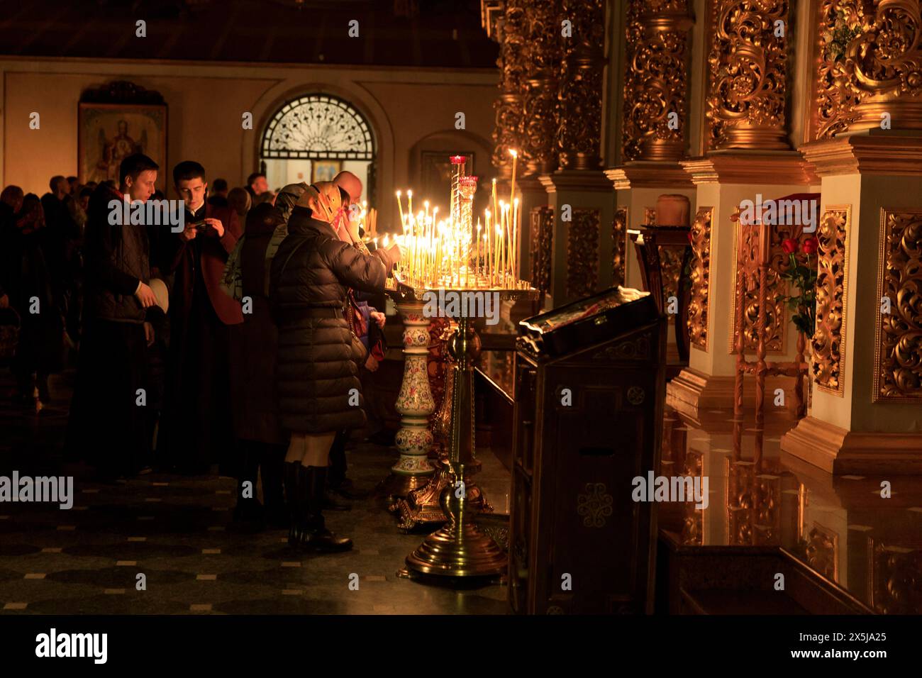 Ukraine, Kiev, Kyiv. Dormition Church Easter celebration. Patrons ...