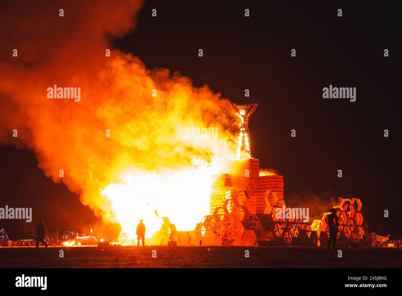 Dramatic Night Fire Scene with Structure Engulfed in Desert Stock Photo ...