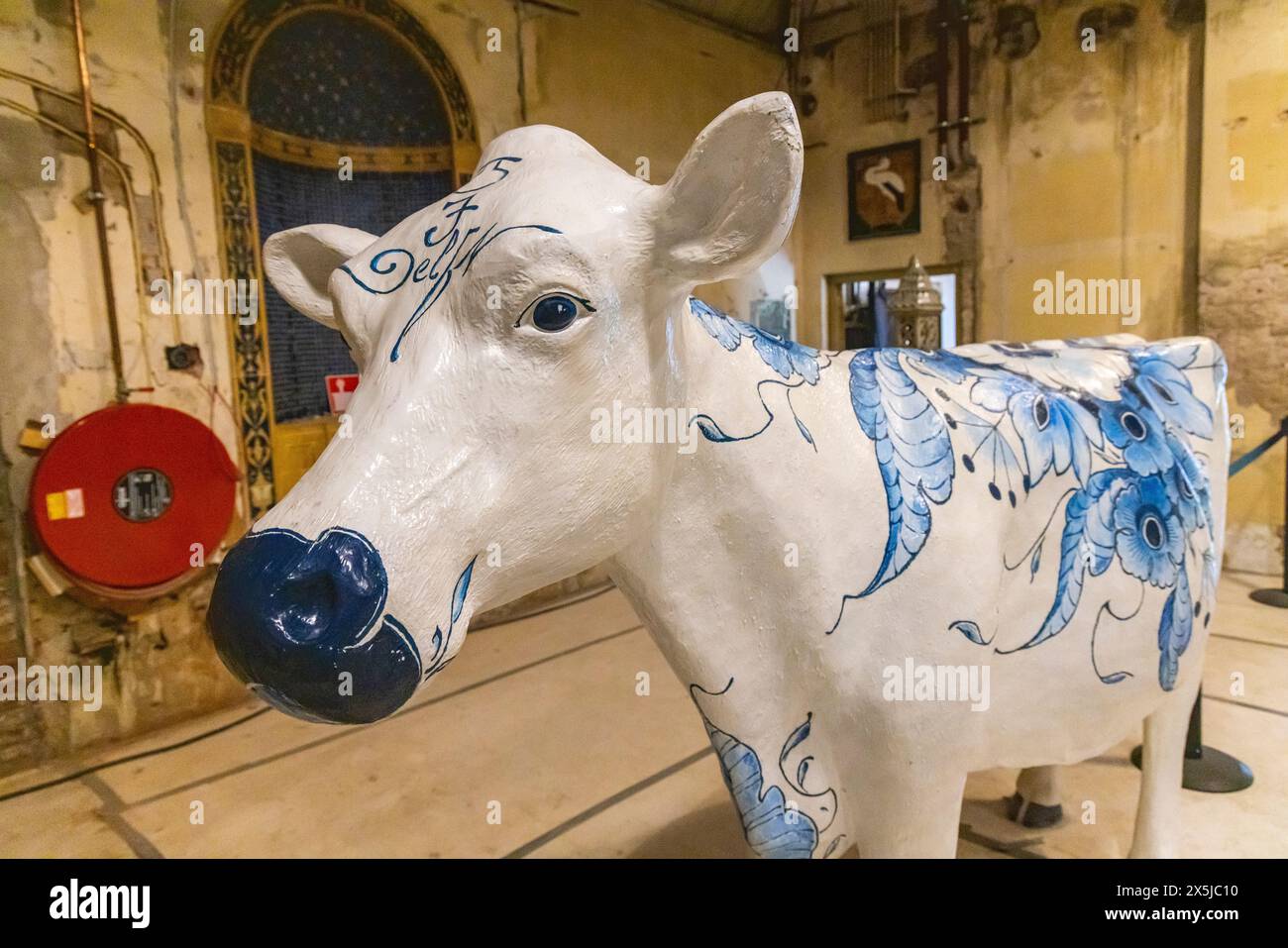 Netherlands, South Holland, Delft. Delftware ceramic sculpture cow at ...
