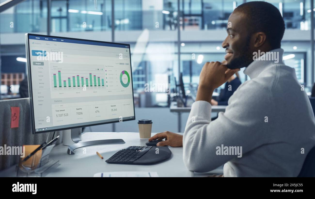 Corporate Office: Handsome Black IT Specialist Using Desktop Computer ...