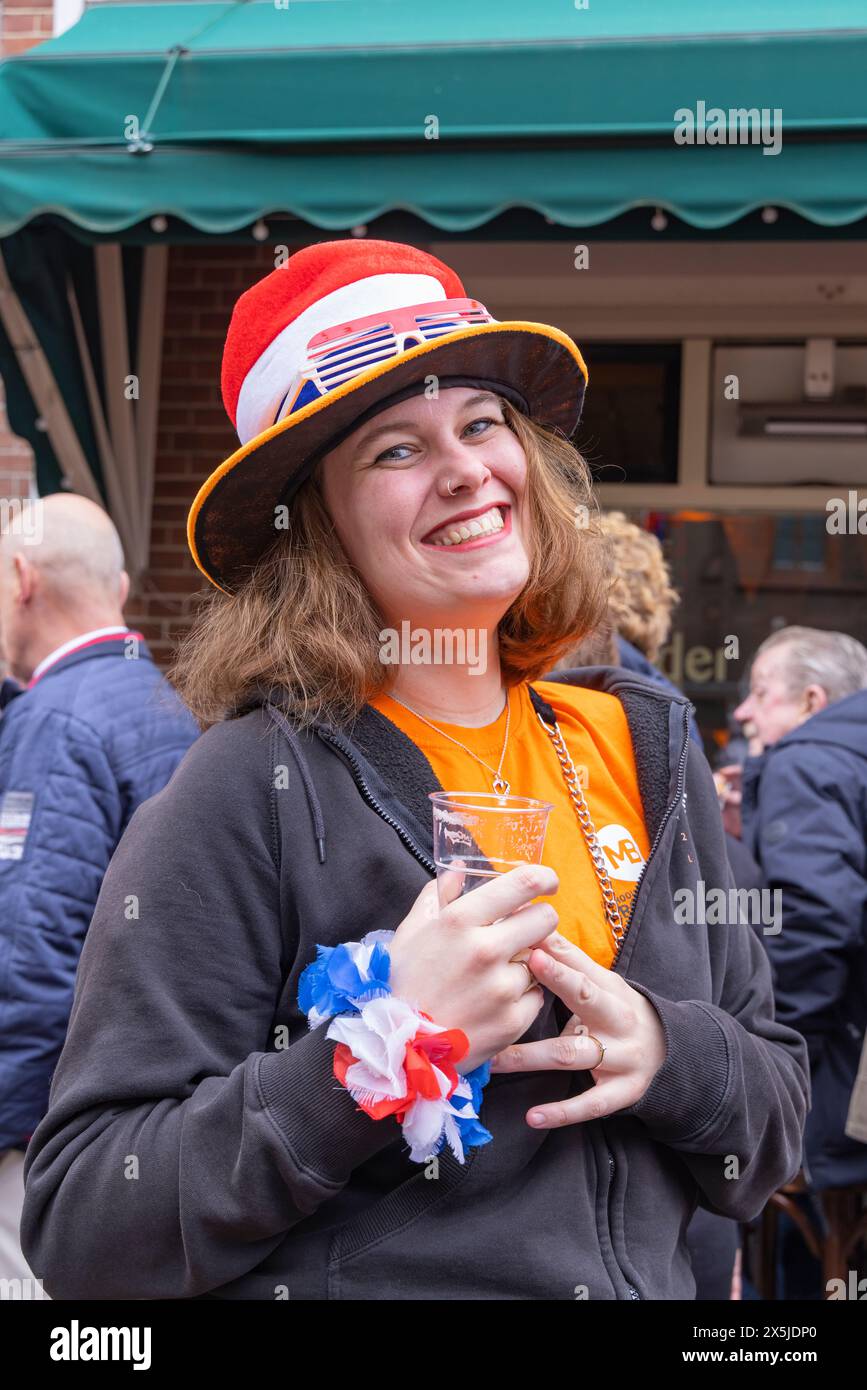Netherlands, Utrecht, Maarssen. Woman attending the King's Day ...
