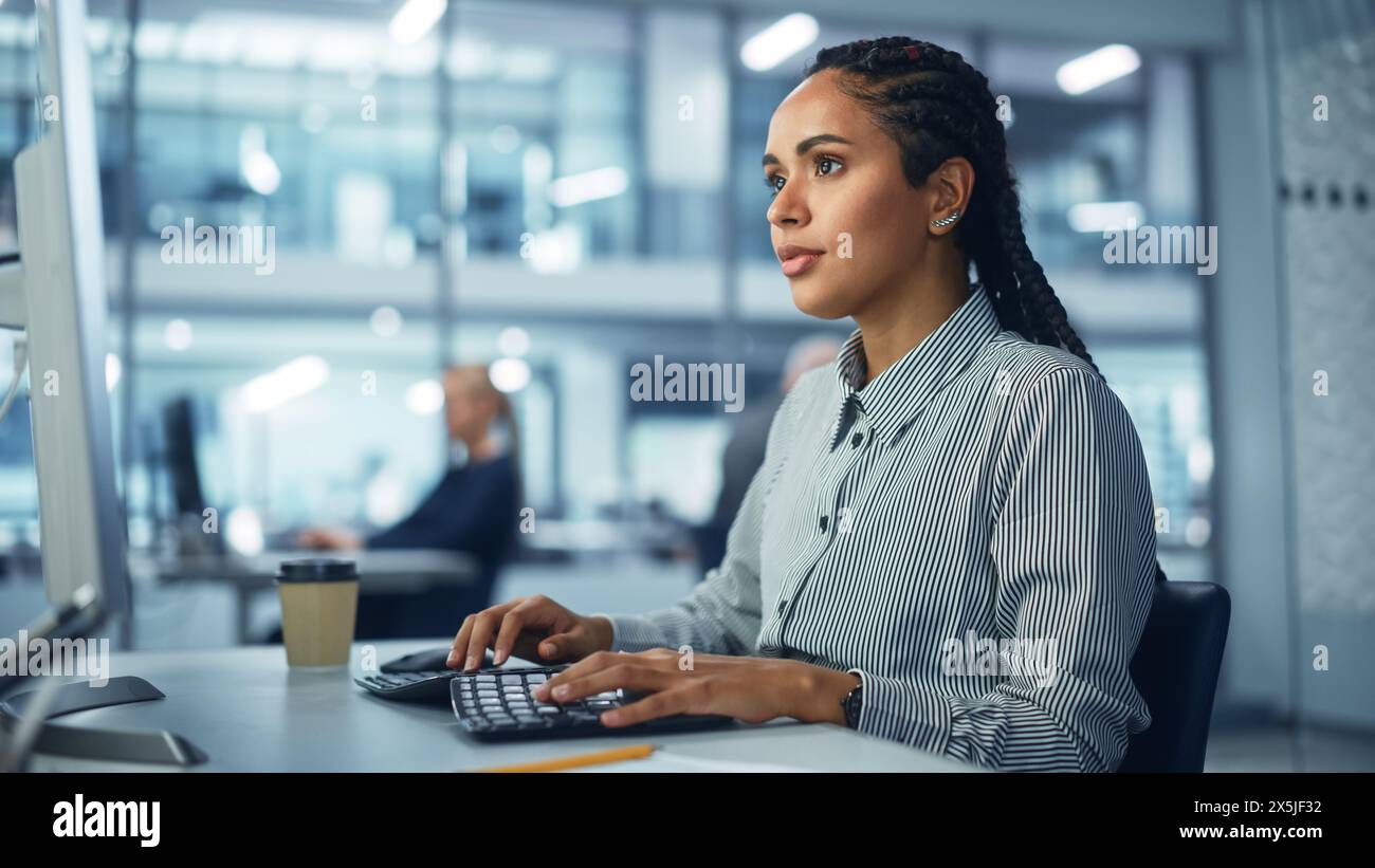 Corporate Office: Black Female IT Technician Using Desktop Computer ...