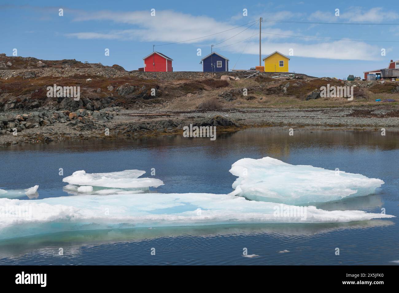Colorful cabins and sea ice in Twillingate, Newfoundland and Labrador ...