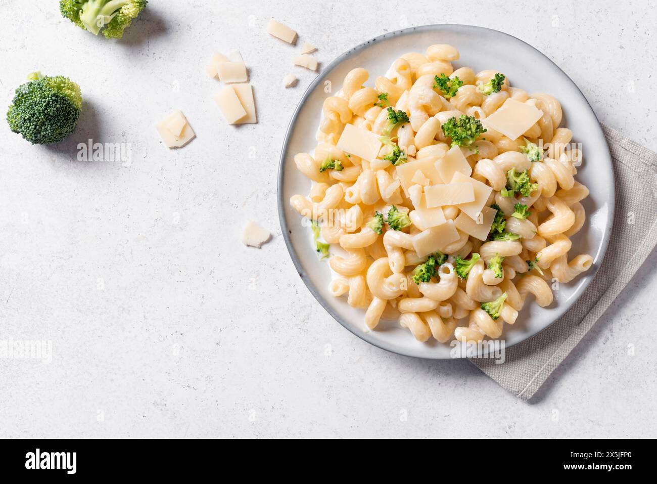 Homemade Cavatappi Alfredo Pasta with Broccoli on white background, top view, copy space. Creamy ...