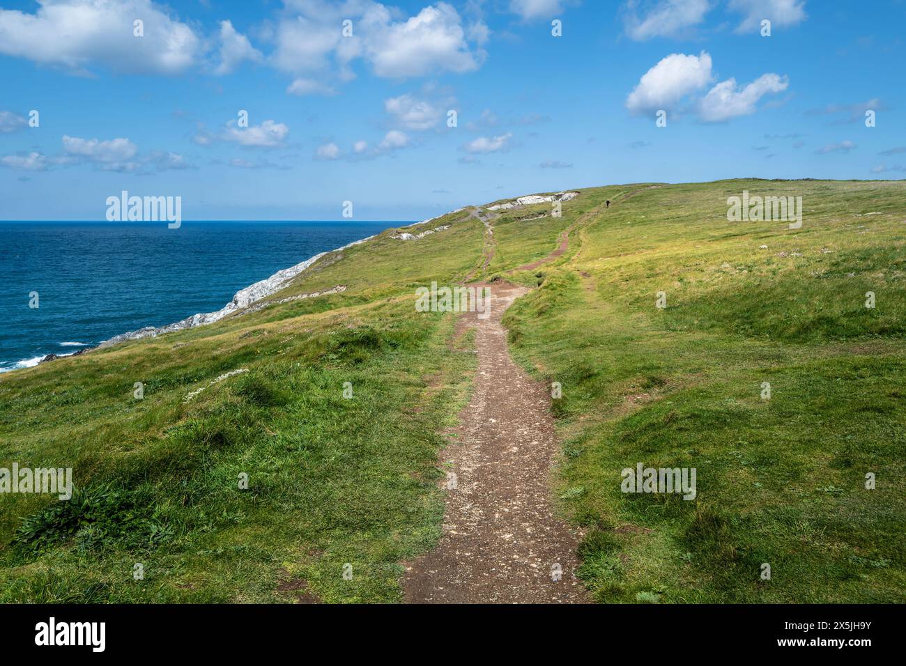 The worn eroded South West Coast path on the coast of Pentire Point ...