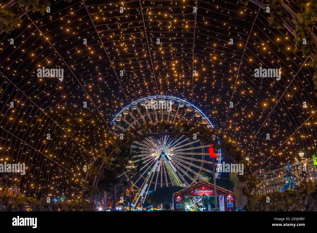 Colorful illuminated ferris wheel, Nice, Cote d'Azur, France. Bienvenue ...
