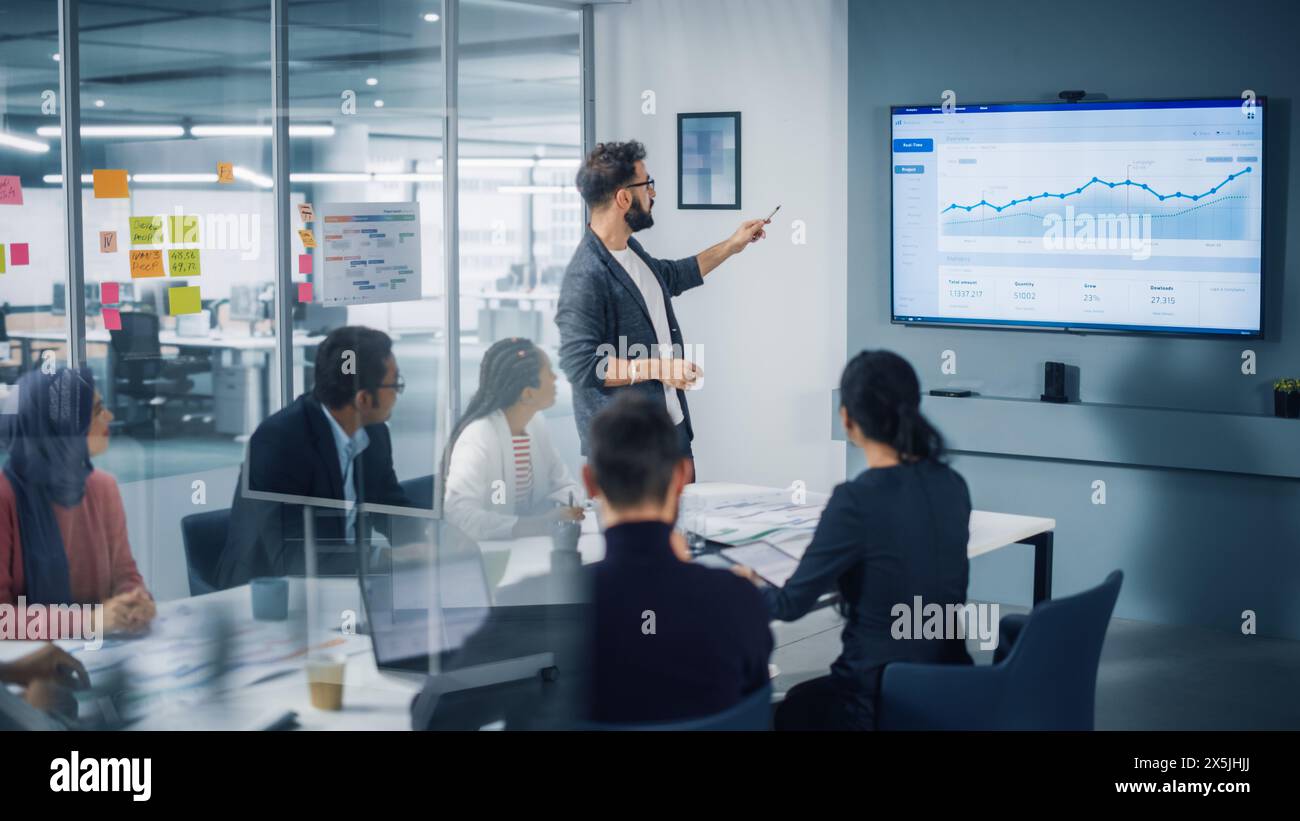 Diverse Modern Office: Motivated Businessman Leads Business Meeting ...