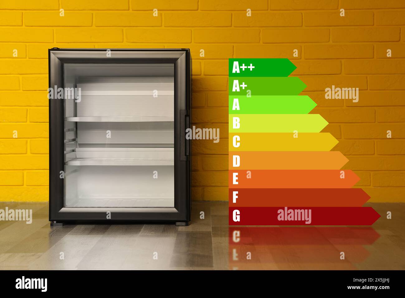Energy efficiency rating label and refrigerator indoors Stock Photo - Alamy