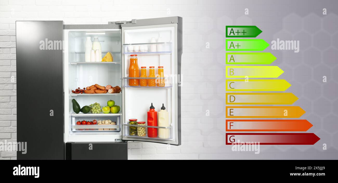Energy efficiency rating label and open refrigerator indoors, banner ...