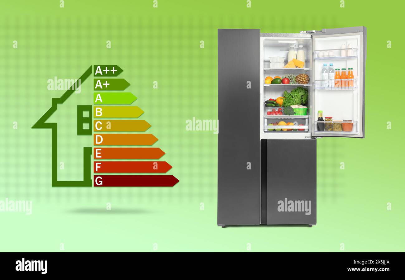 Energy efficiency rating label and refrigerator on green background ...