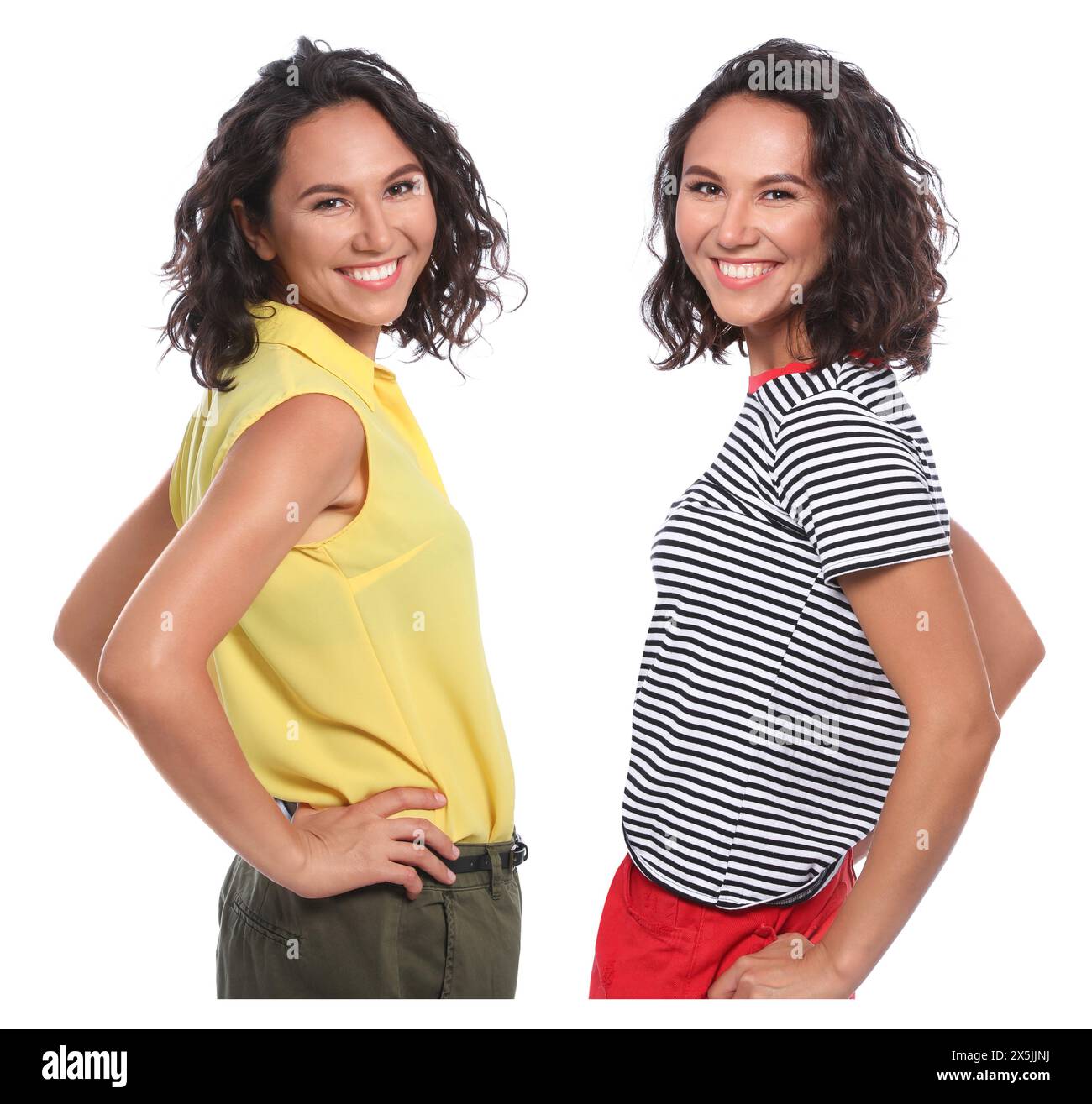 Portrait of twin sisters on white background Stock Photo - Alamy