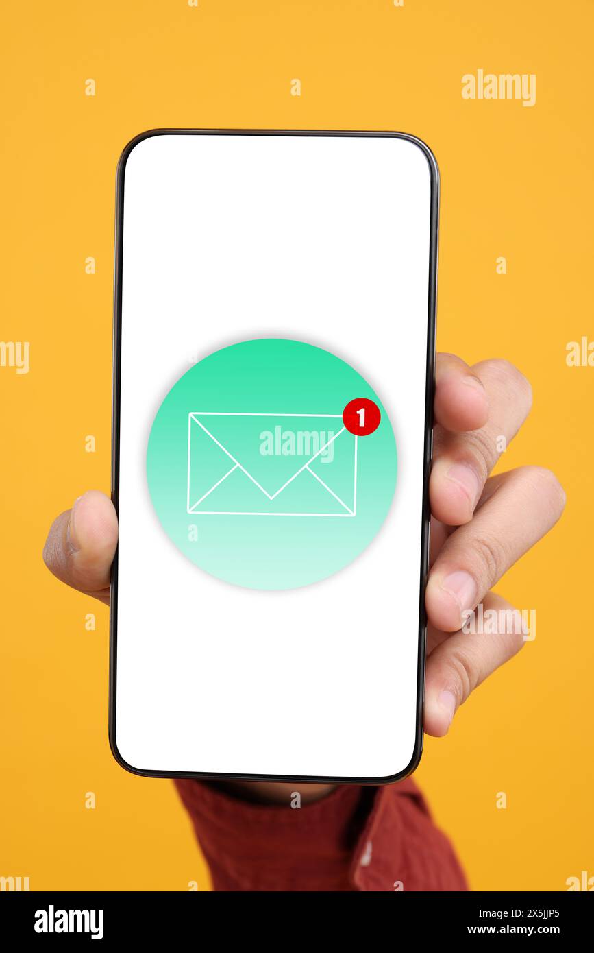 Man showing mobile phone with new message notification on screen ...