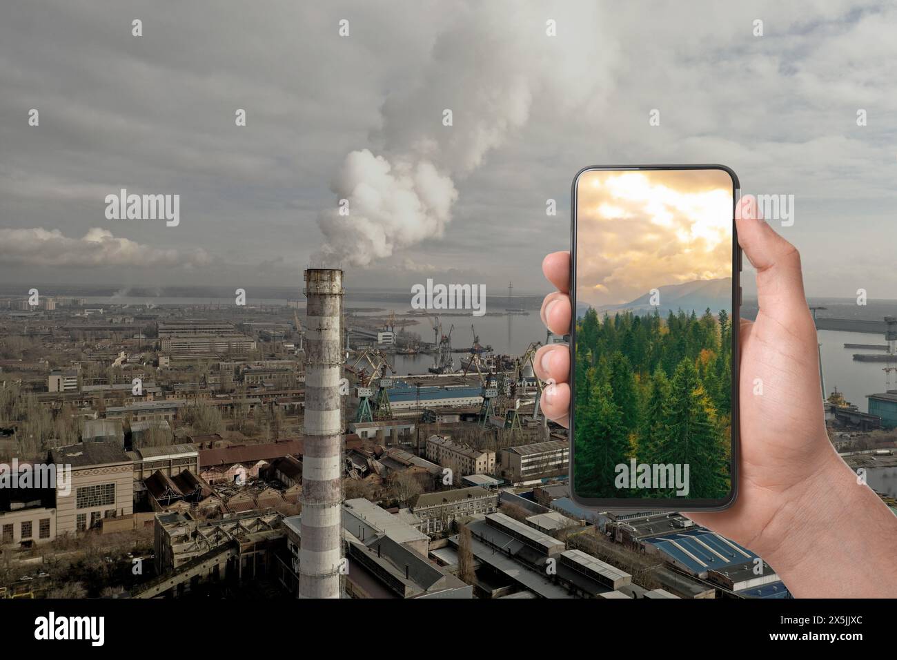 Environmental pollution. Man holding phone with beautiful mountain ...