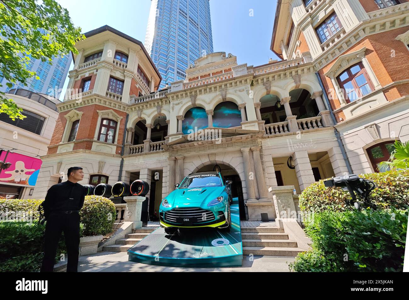 SHANGHAI, CHINA - MAY 10, 2024 - An Aston Martin DBX car leans on the ...