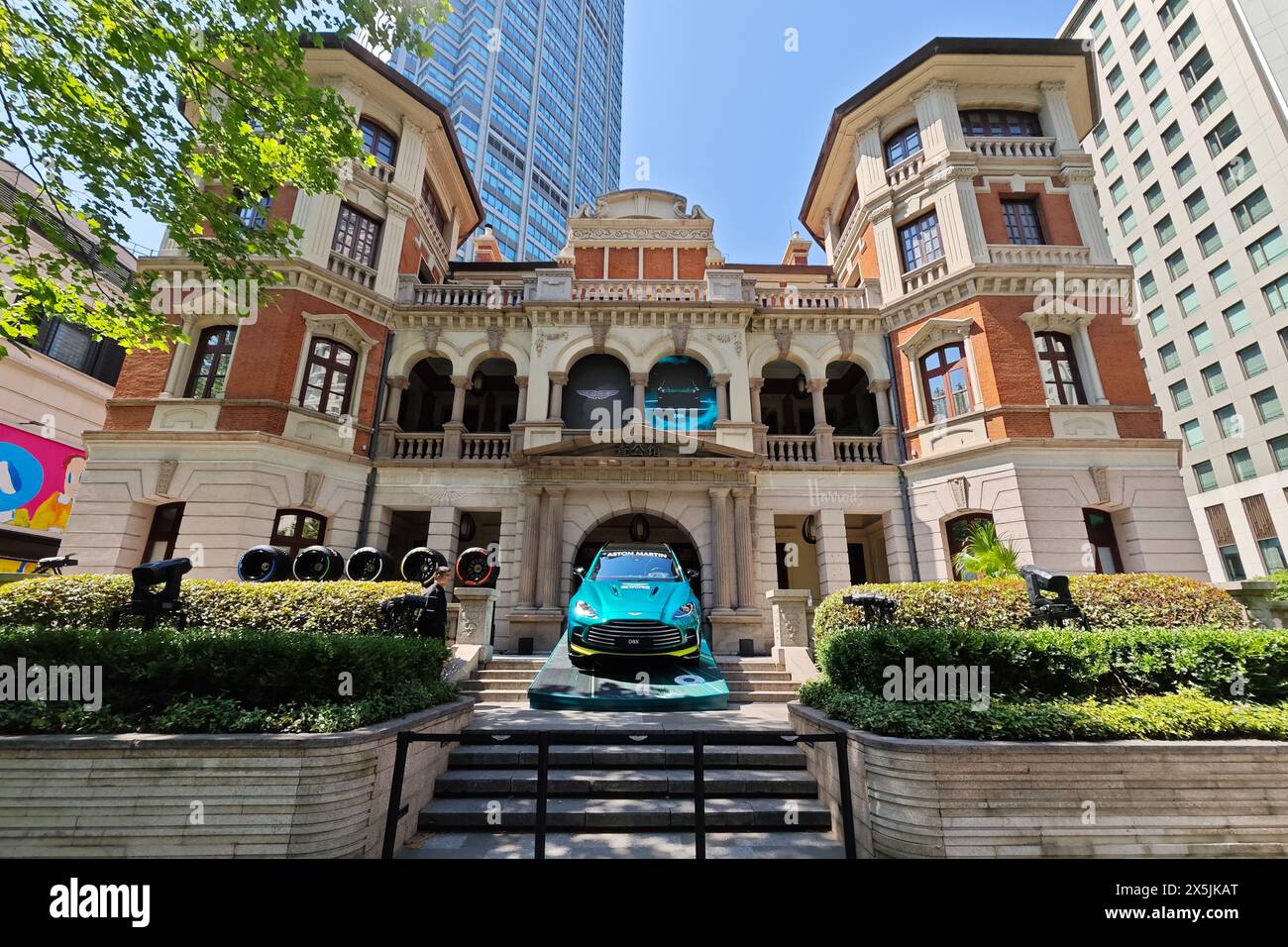 SHANGHAI, CHINA - MAY 10, 2024 - An Aston Martin DBX car leans on the ...